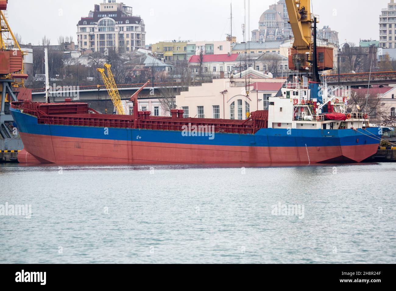 Vessel dry cargo on loading, unloading in port. Bulker in port. port ...