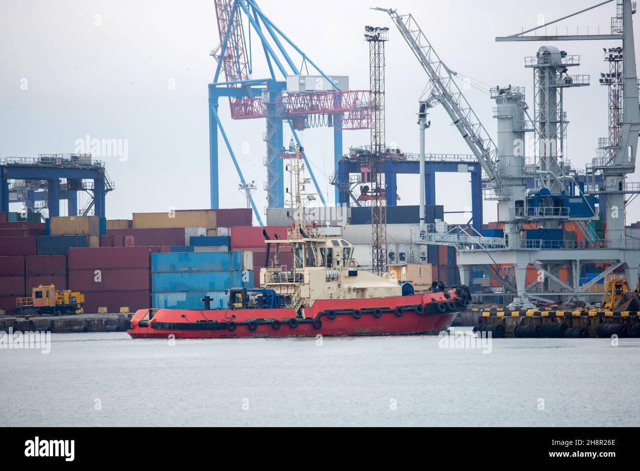 tug ship support at sea port Stock Photo - Alamy
