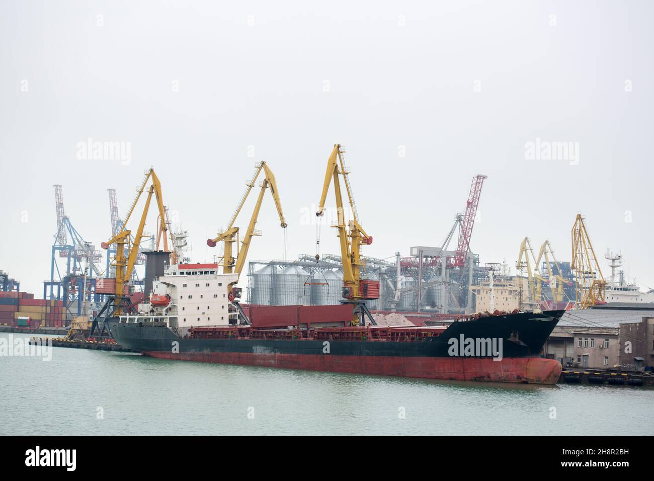 Vessel dry cargo on loading, unloading in port. Bulker in port. port ...