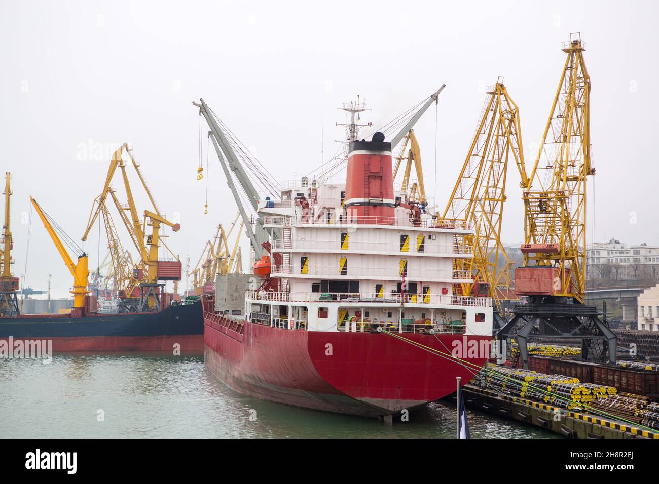 Vessel dry cargo on loading, unloading in port. Bulker in port. port ...