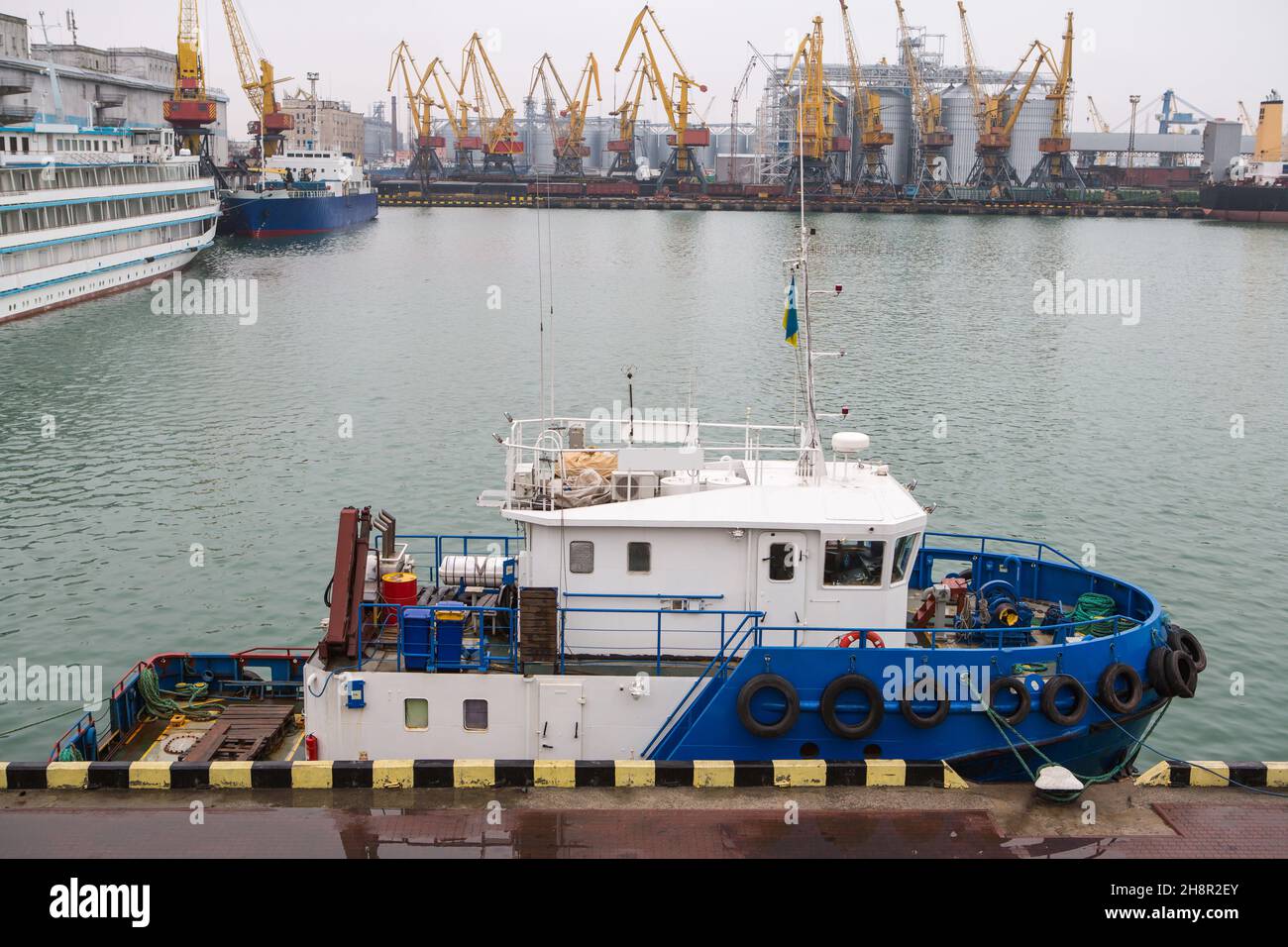 tug ship support at sea port Stock Photo - Alamy