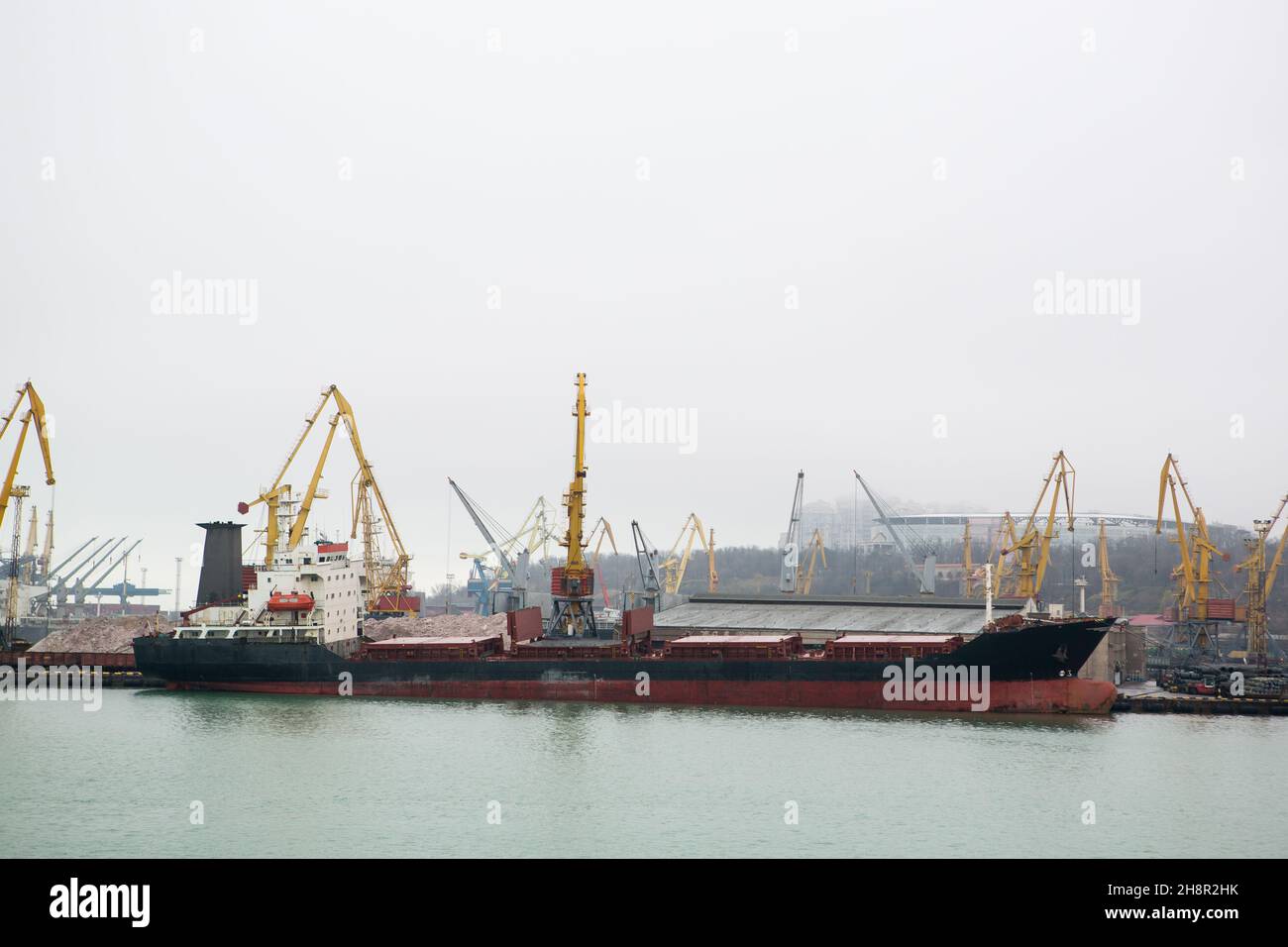 Vessel dry cargo on loading, unloading in port. Bulker in port. port ...