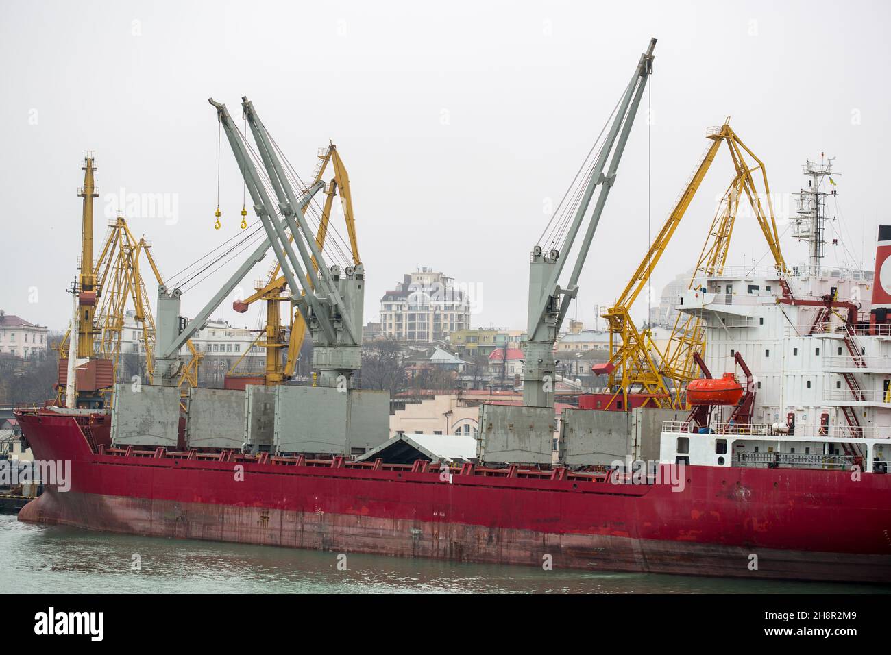 Vessel dry cargo on loading, unloading in port. Bulker in port. port ...