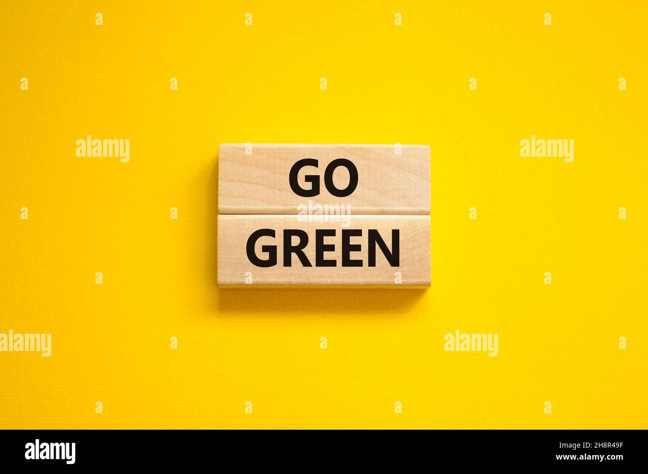 Time to go green ecology symbol. Concept words Go green on wooden ...