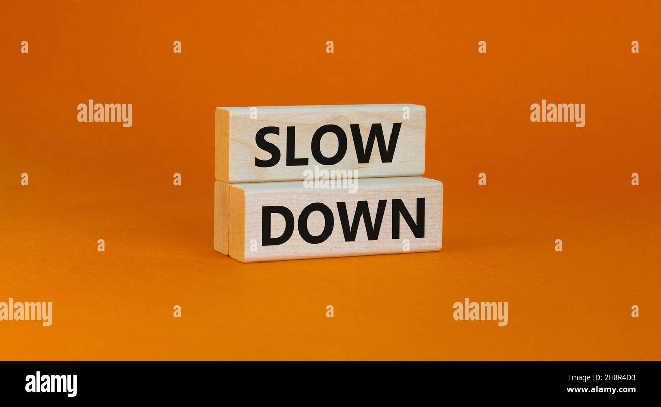 Time to slow down symbol. Concept words Slow down on wooden blocks on a ...