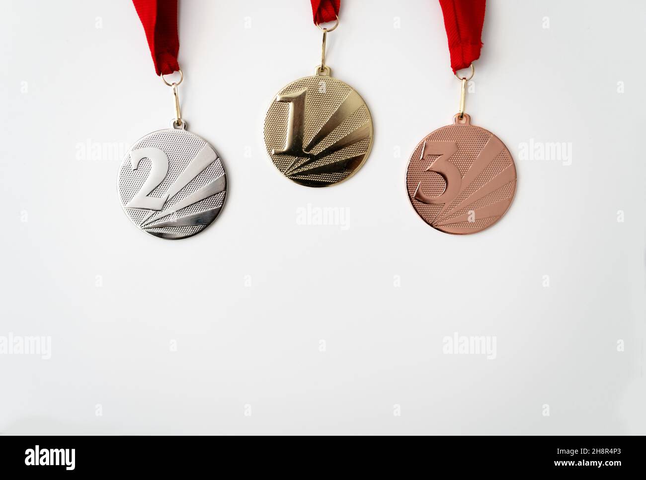 gold, silver and bronze medals with numbers on white isolated ...