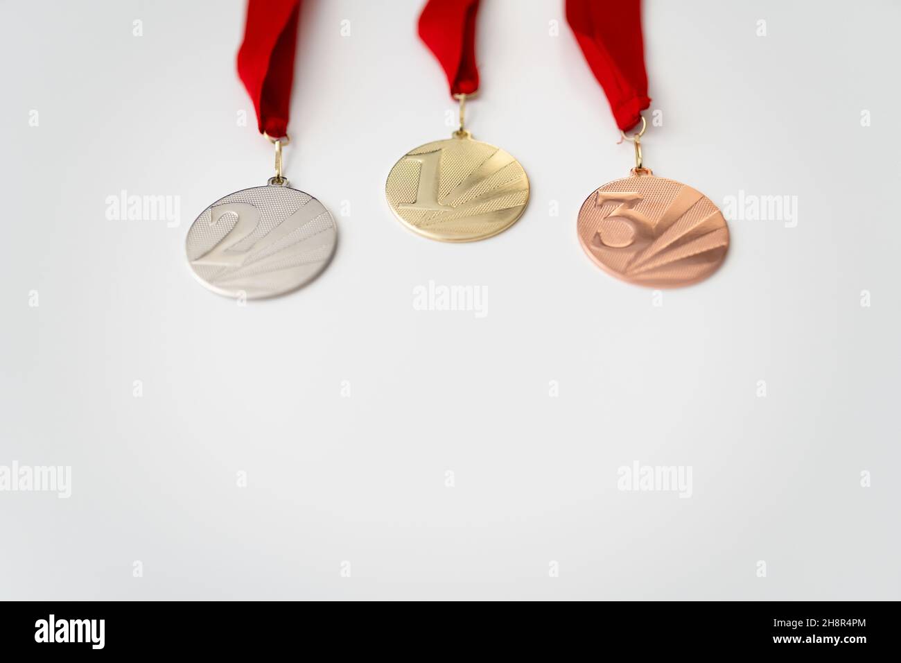 gold, silver and bronze medals with numbers on white isolated ...