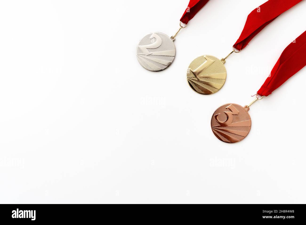 gold, silver and bronze medals with numbers on white isolated ...