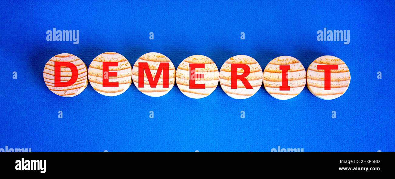 Demerit symbol. The concept word Demerit on wooden circles. Beautiful ...