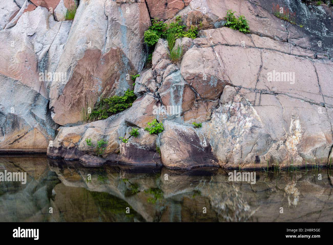 Granite outcrop reflections in George Lake, Killarney Provincial Park ...