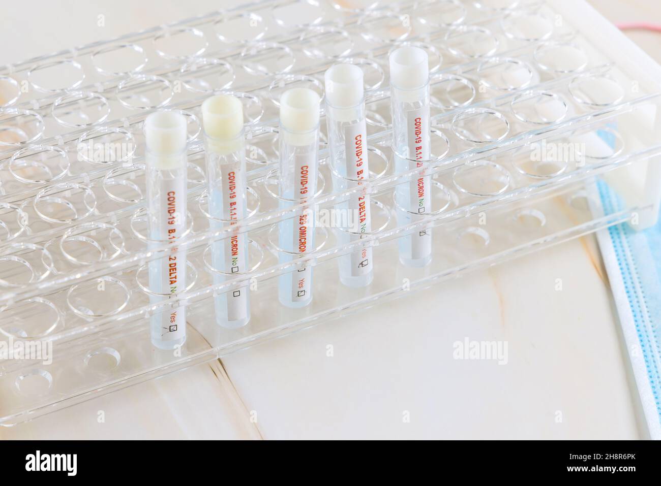 Tube containing a swab sample for COVID-19 that has tested positive of ...