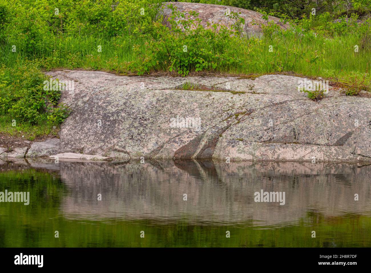 Rock reflections in Chikanishing Creek, Killarney Provincial Park ...