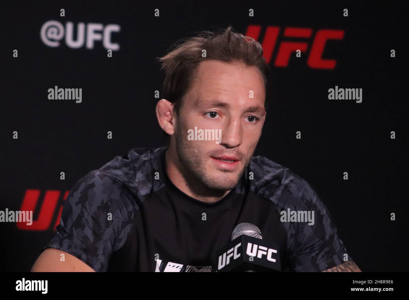 LAS VEGAS, NV - DECEMBER 1: Brad Riddell of New Zealand interacts with ...