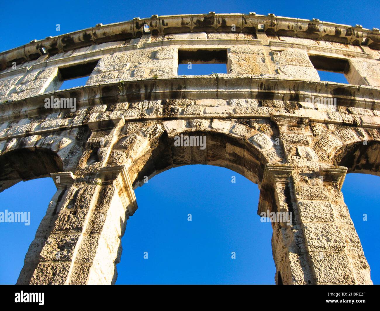 Low angle shot of the arch and vault of the Pula Arena in Croatia Stock ...