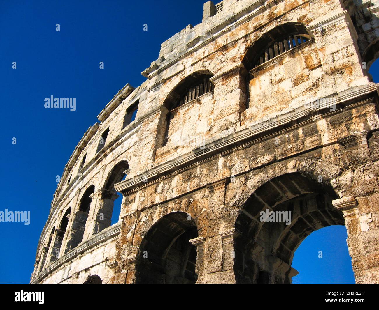Low angle shot of the arch and vault of the Pula Arena in Croatia Stock ...