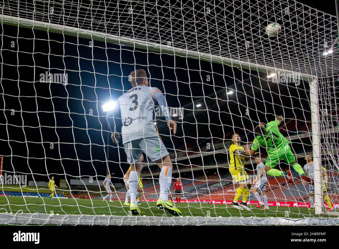 Brisbane Roar player Jamie Young (21) tips the ball over the bar Credit ...