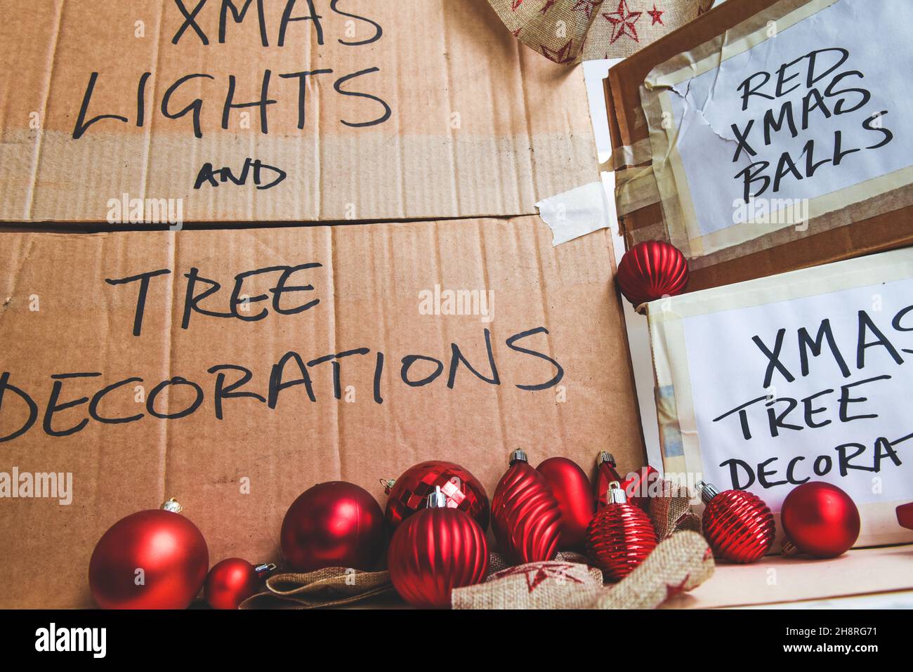 Boxes and containers of festive christmas lights and decorations Stock ...