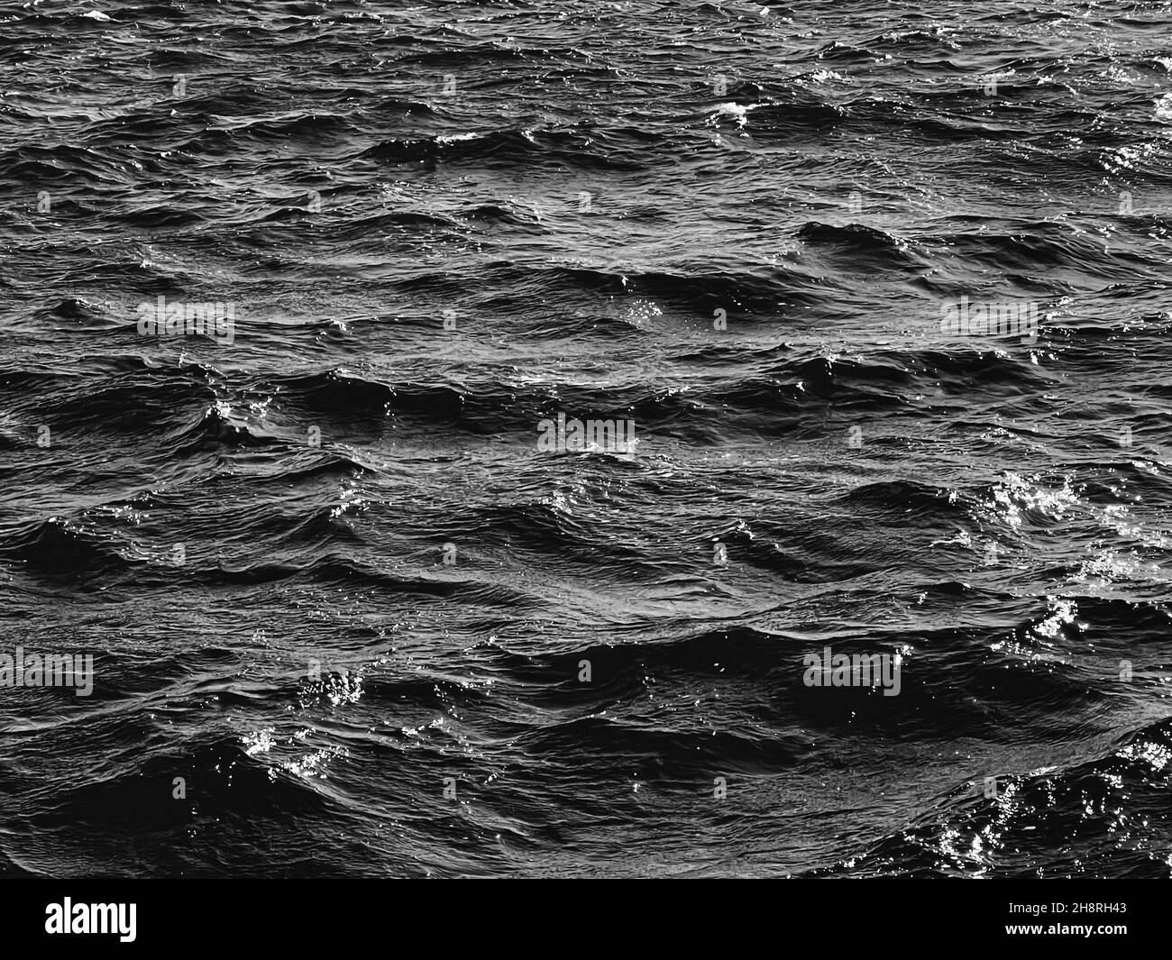 Sea, texture and coastal nature concept. Ocean water as black and white ...