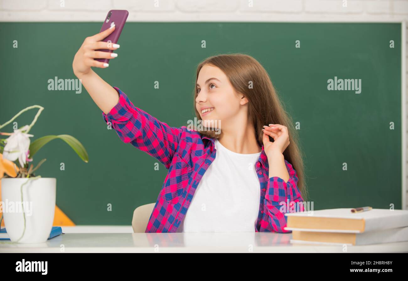 happy child making selfie. school blogger. vlogger with cellphone in ...