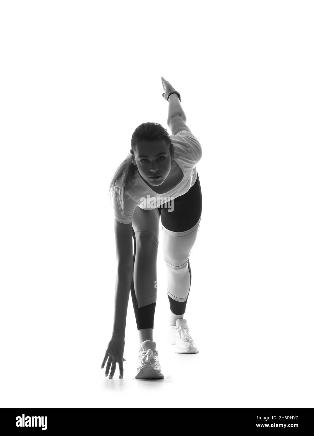 Silhouette of sporty female runner on white background Stock Photo - Alamy