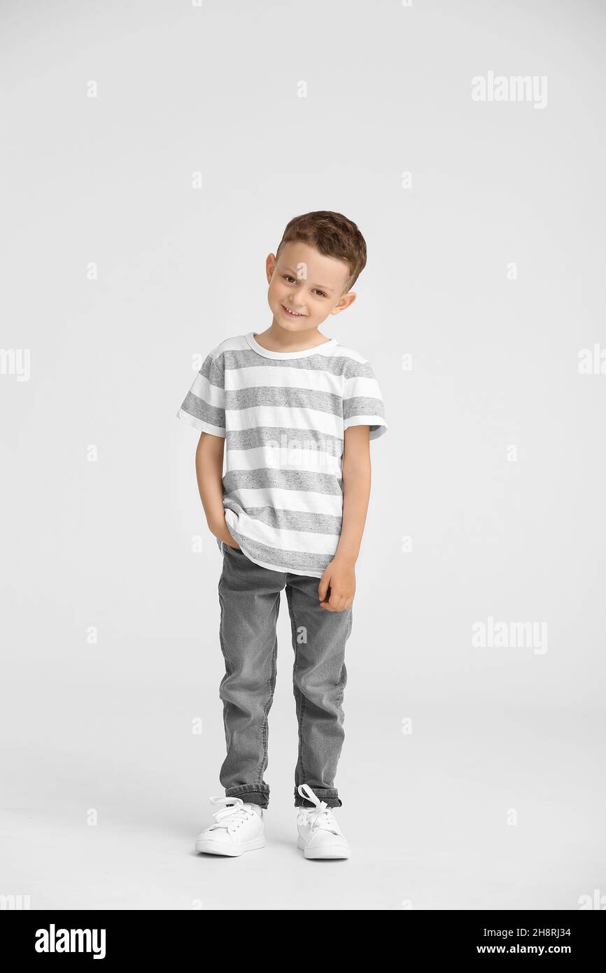 Portrait of cute little boy on light background Stock Photo - Alamy