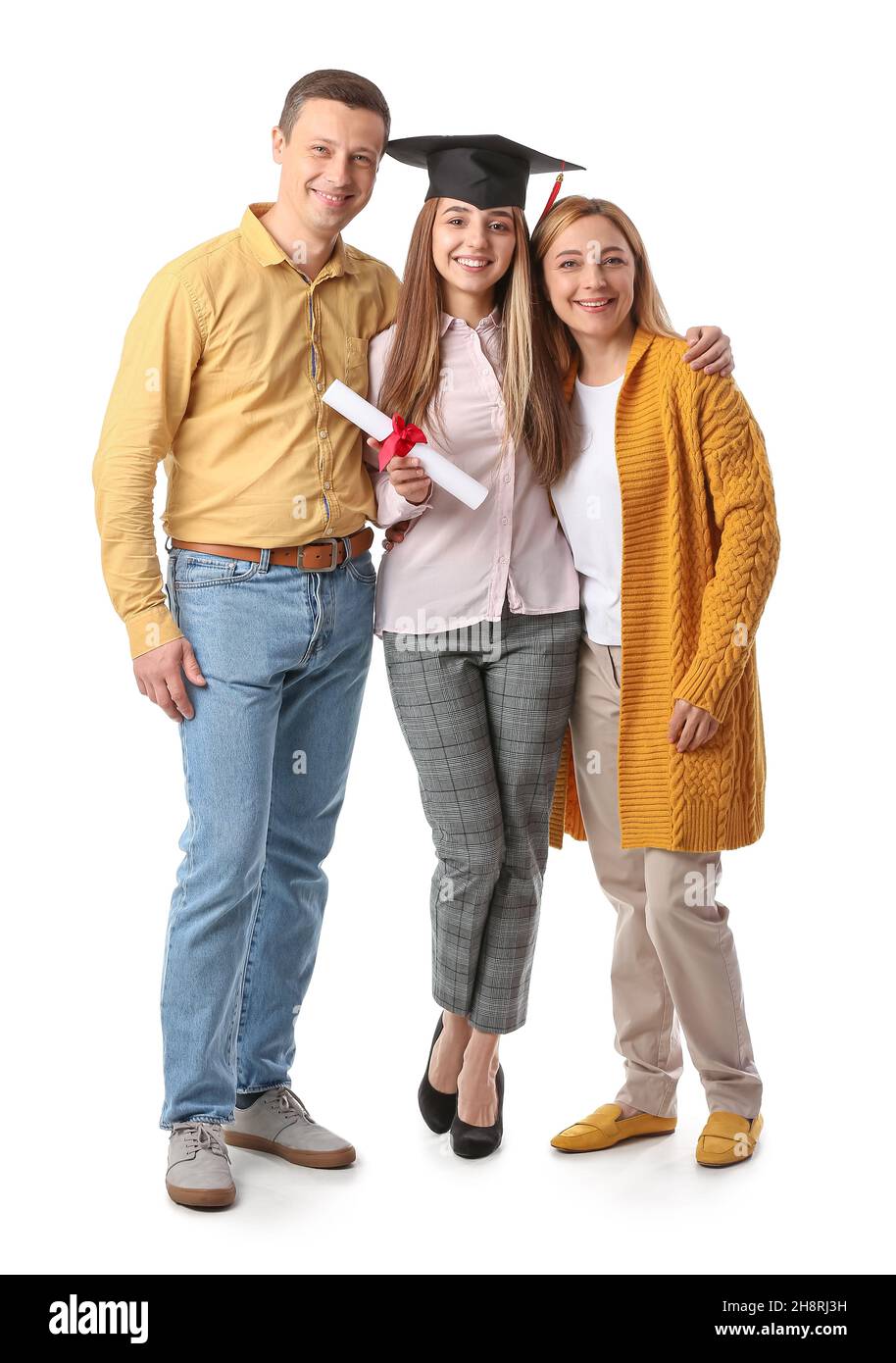 Happy female graduation student with her parents on white background ...