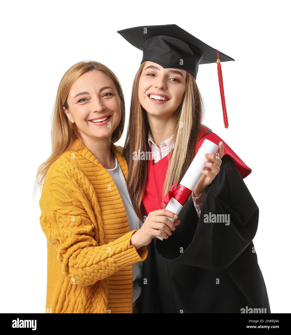 Happy female graduation student with her mother on white background ...