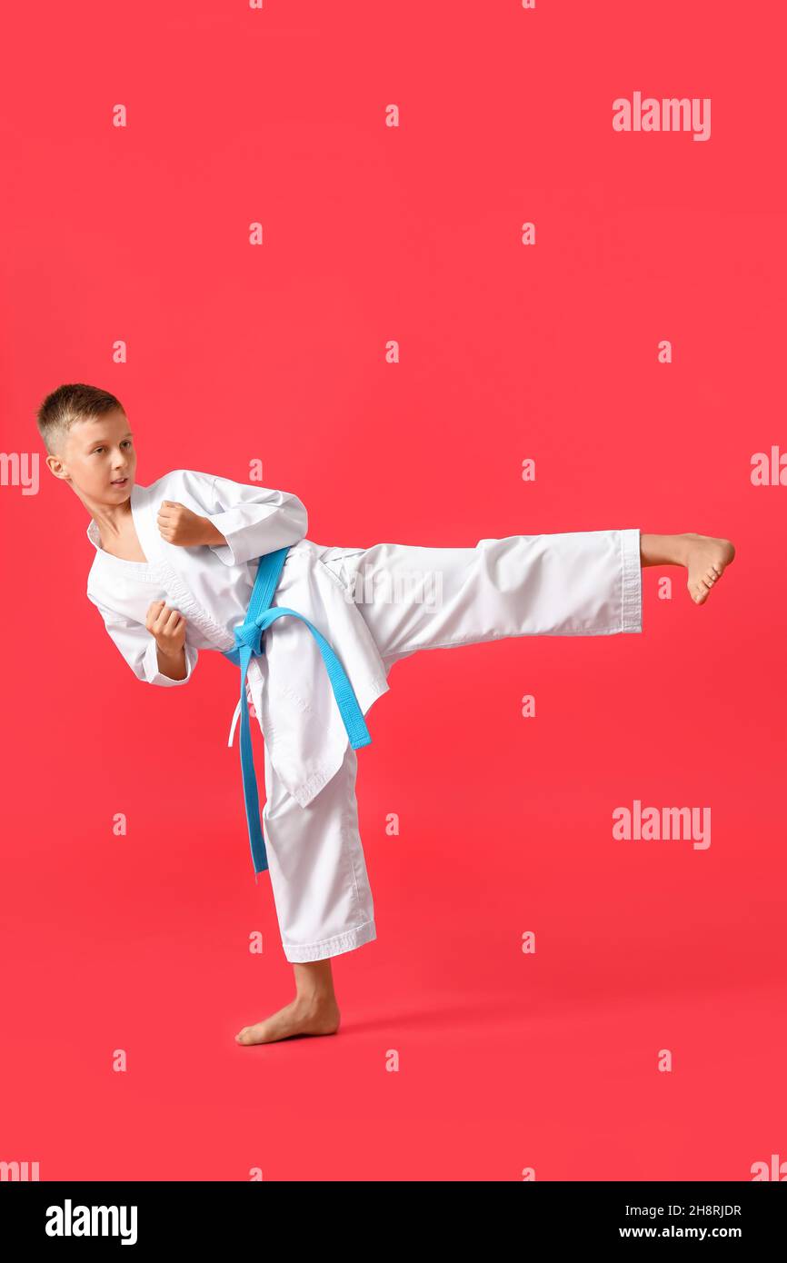 Little boy practicing karate on color background Stock Photo - Alamy
