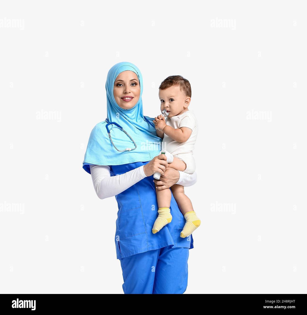 Muslim pediatrician with baby boy on light background Stock Photo - Alamy