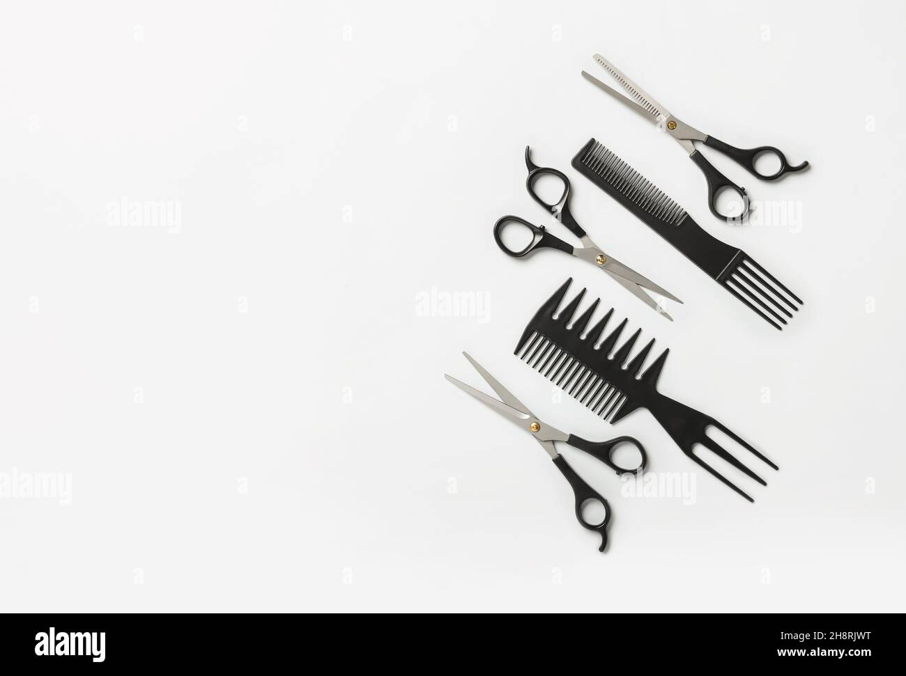 Scissors and combs on white background Stock Photo - Alamy