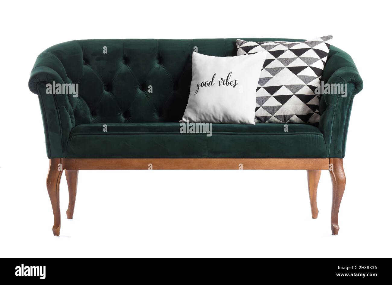 Deep green sofa with pillows on white background Stock Photo - Alamy