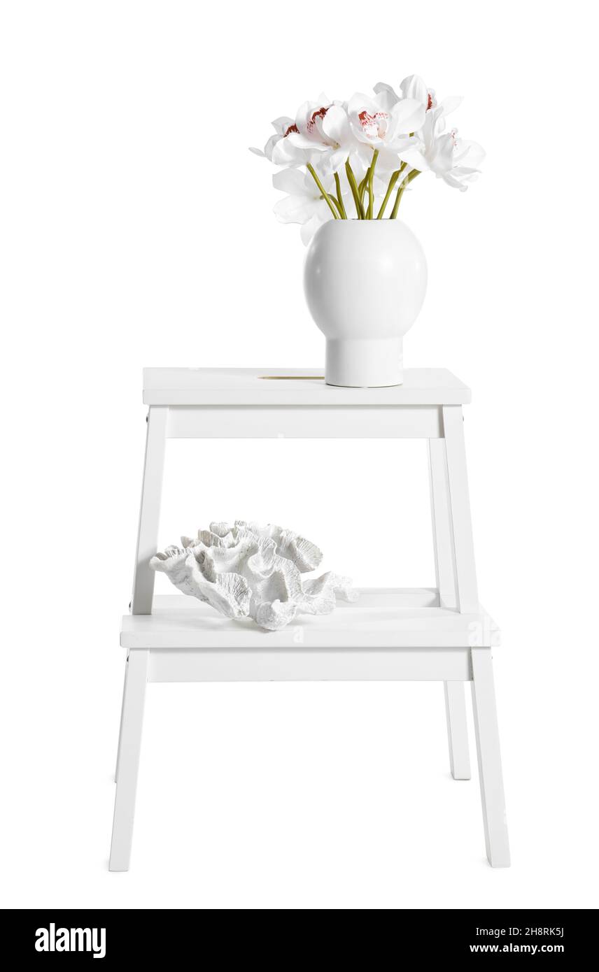 Modern step stool with flowers in vase and decor on white background ...