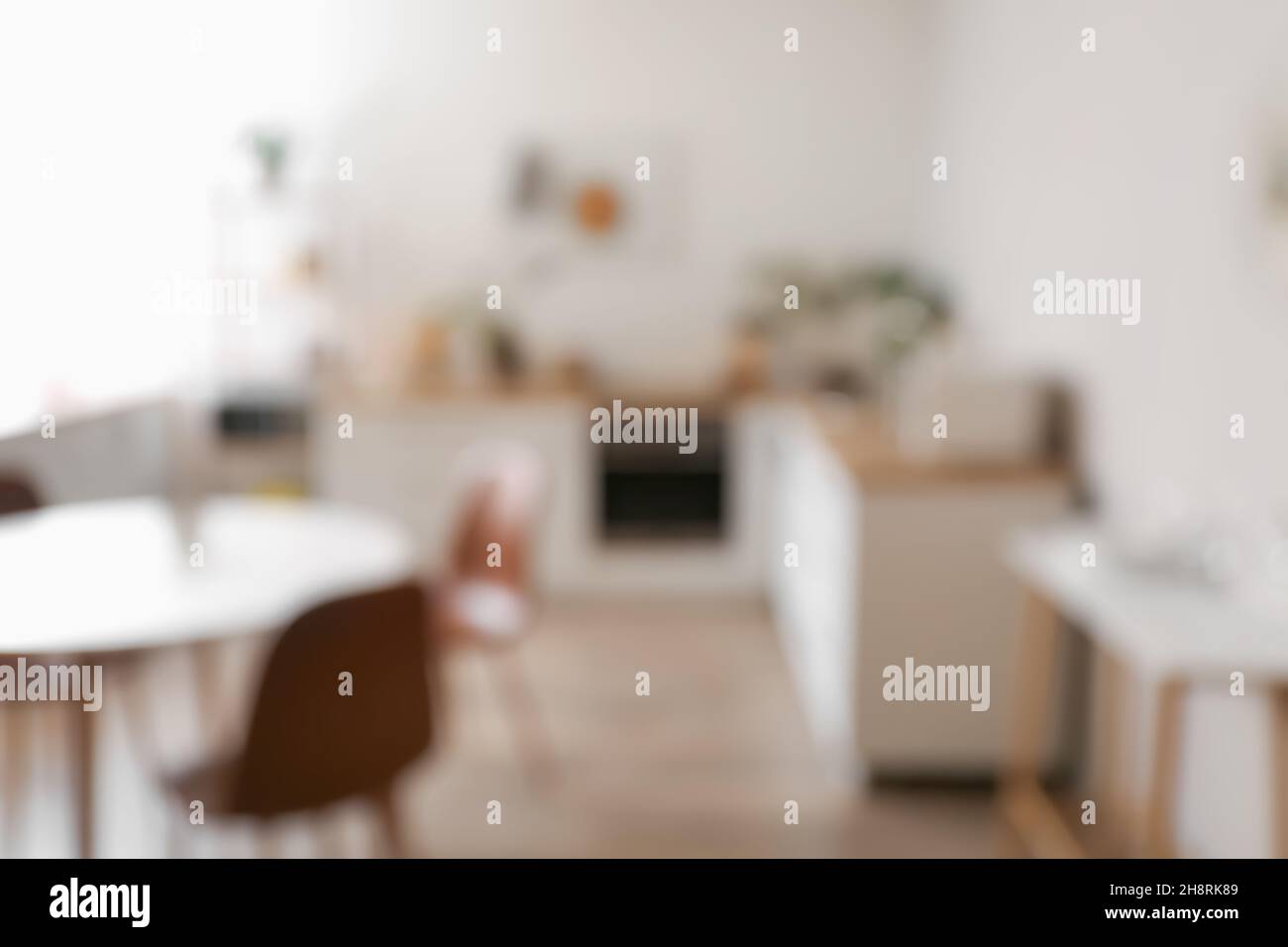 Blurred view of light modern kitchen Stock Photo - Alamy