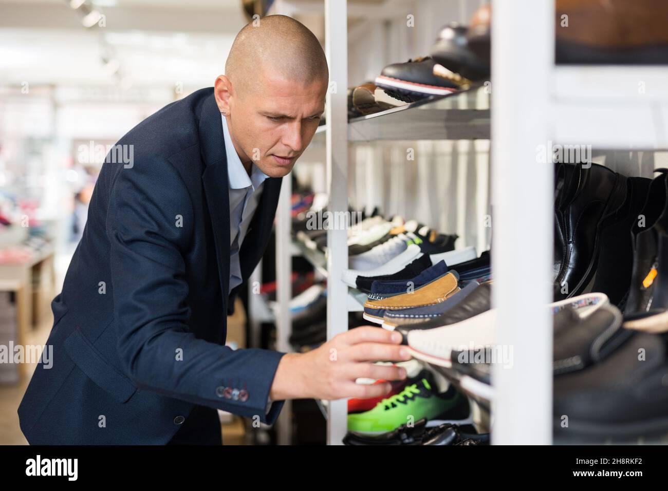 Man choosing shoes hi-res stock photography and images - Alamy