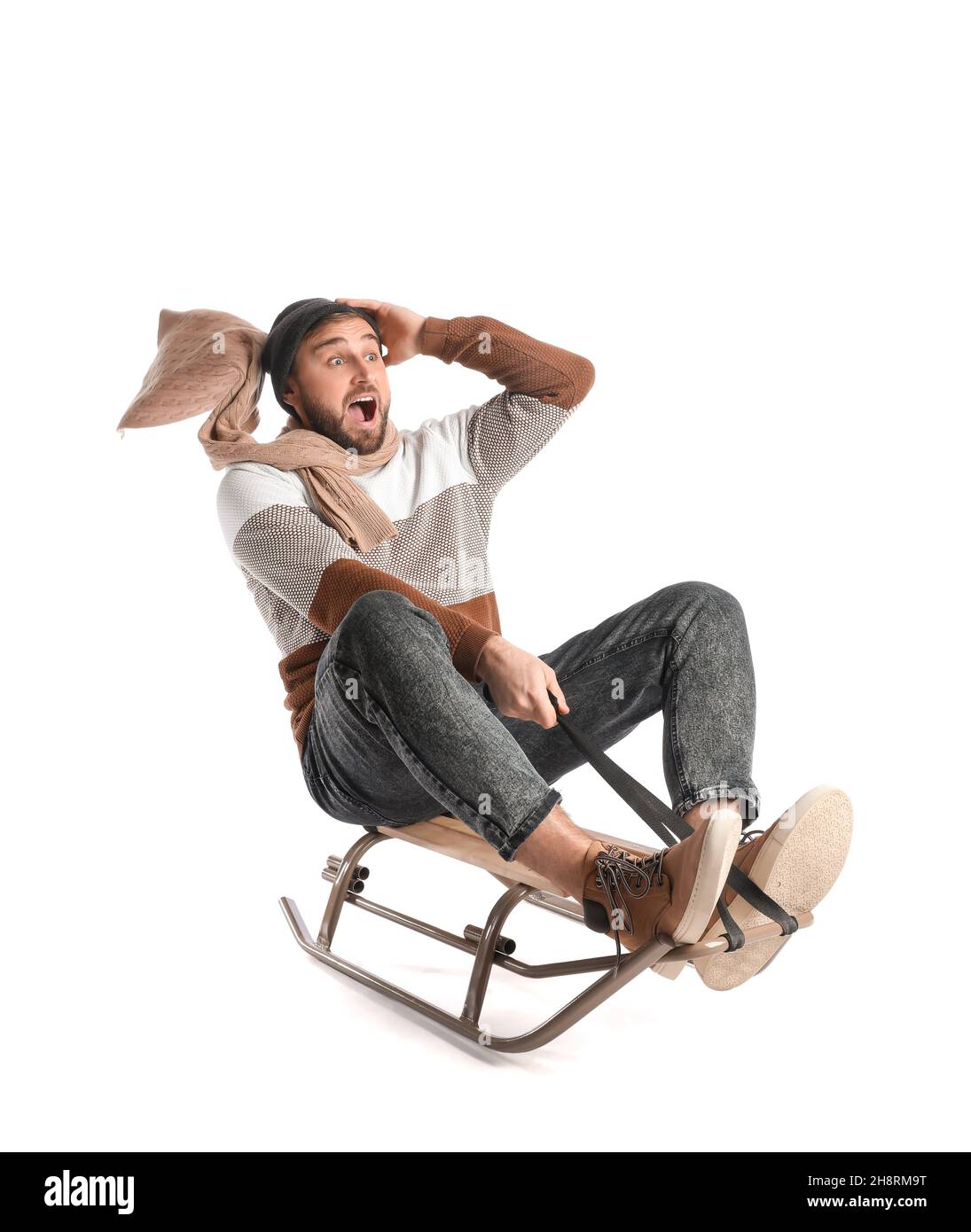 Young sledding man on white background Stock Photo - Alamy