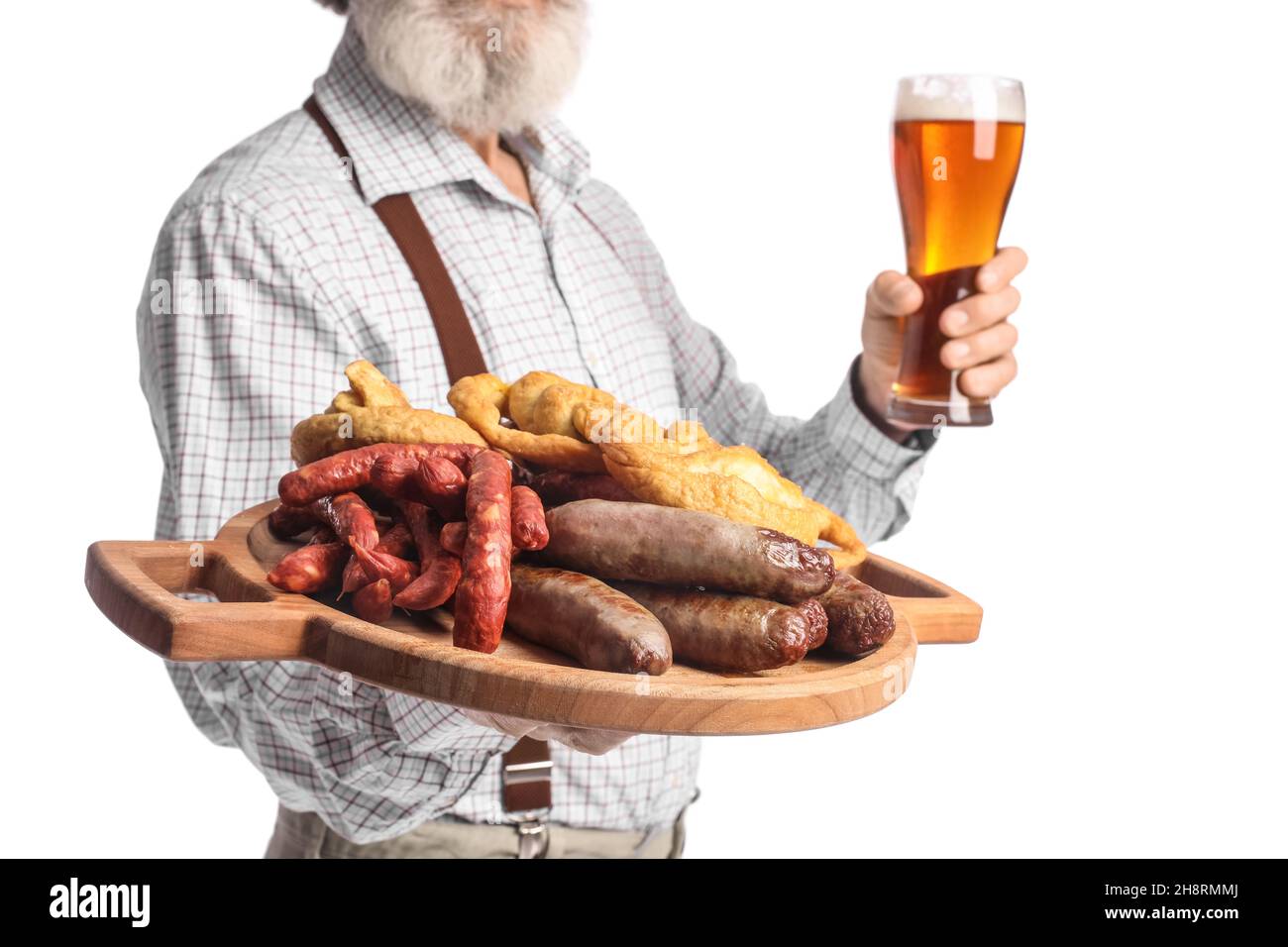 Man in traditional German clothes, with beer and snacks on white ...