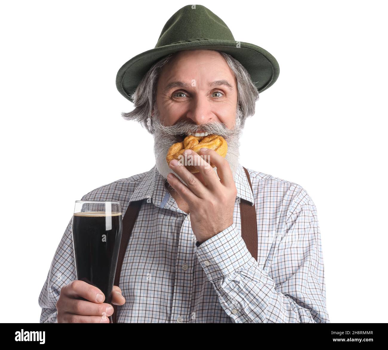 Handsome senior man in traditional German clothes, with beer and ...