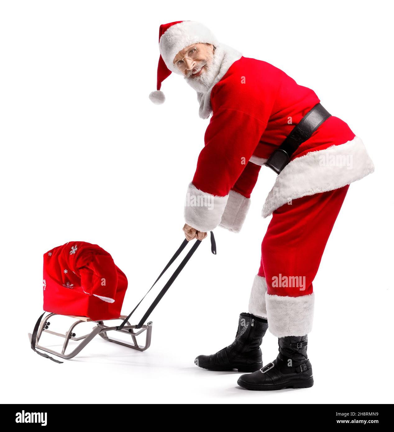 Santa Claus with sled on white background Stock Photo - Alamy