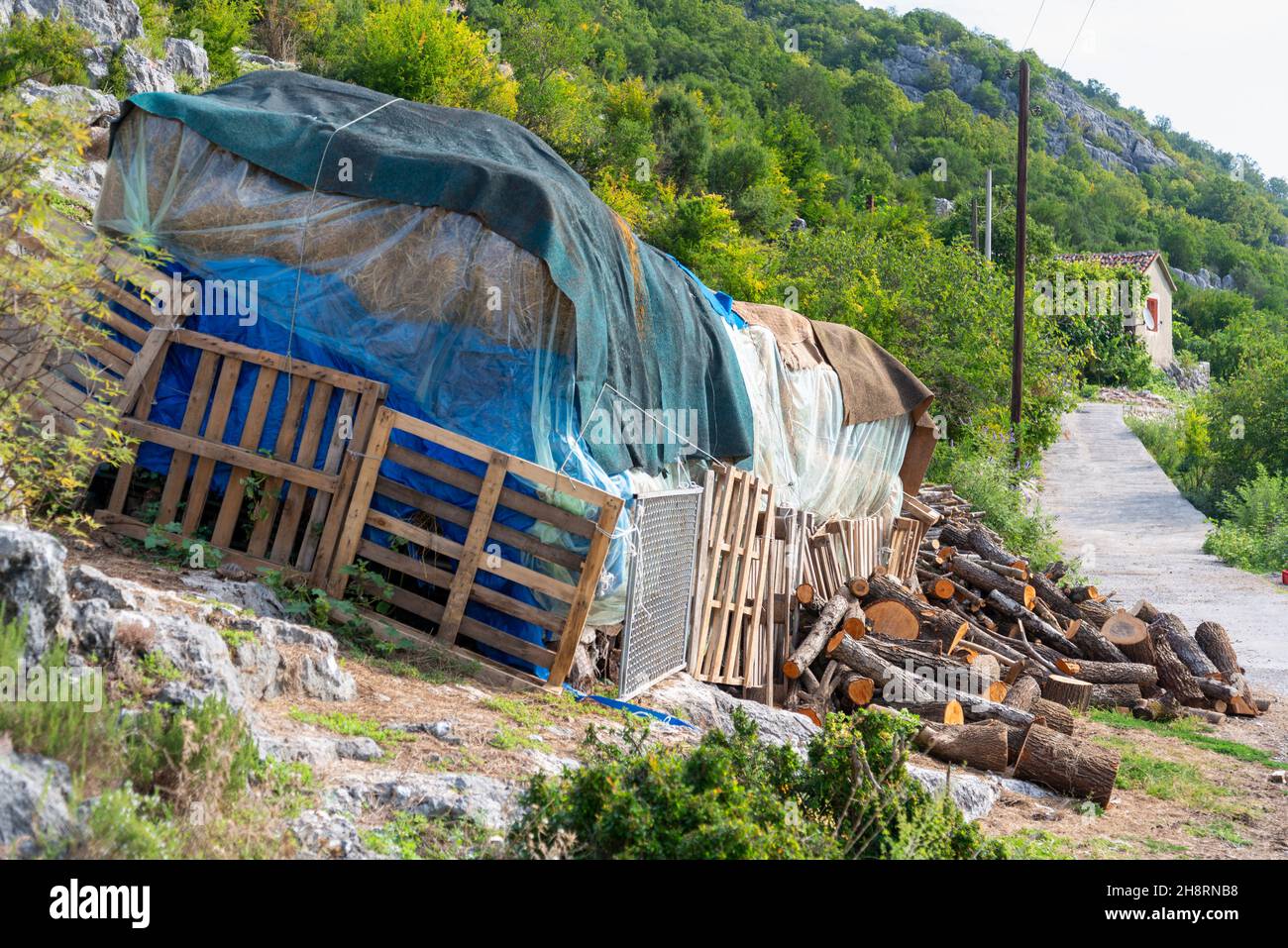 Protected bt wooden pallets ad water proof covering to shield from the ...