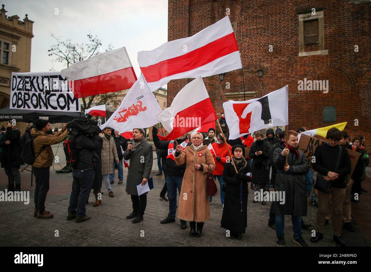 Protesters hold Polish flags during the demonstration. Earlier this ...