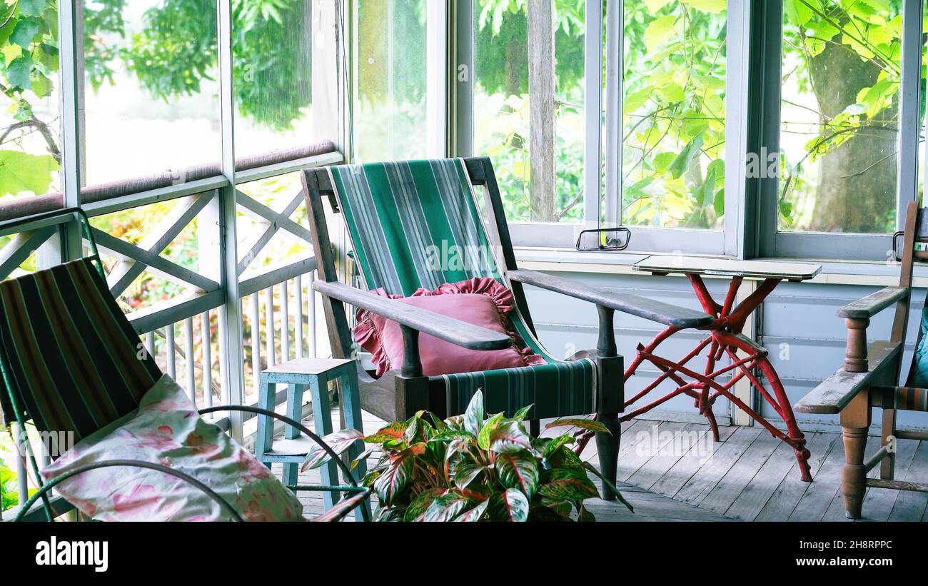 Casual chairs for relaxing on verandah of historic pioneering family ...