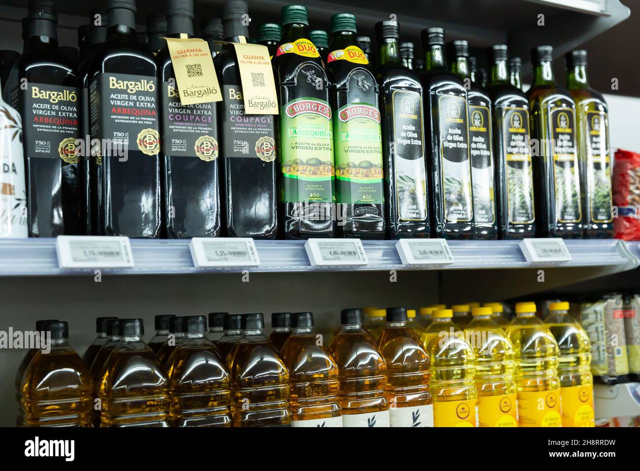 Olive oil on rack in supermarket Stock Photo - Alamy