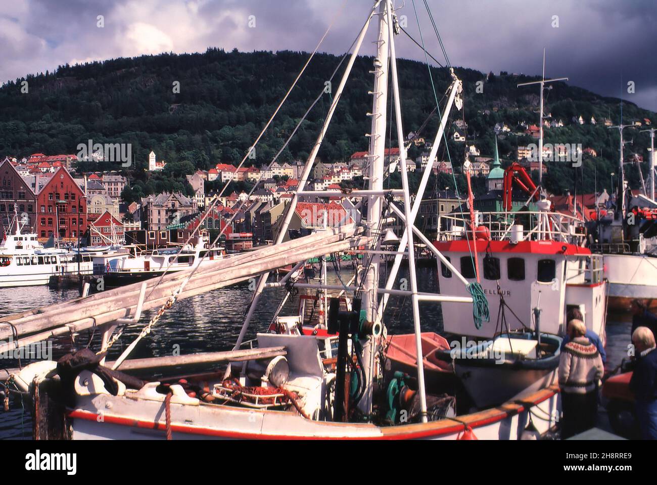 AUG 1982: Workboats in the harbour of Bryggen and colourful buildings ...