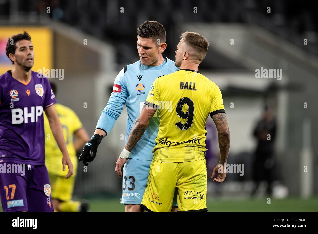 Perth Glory goalkeeper Liam Reddy (33) and Wellington Phoenix forward ...