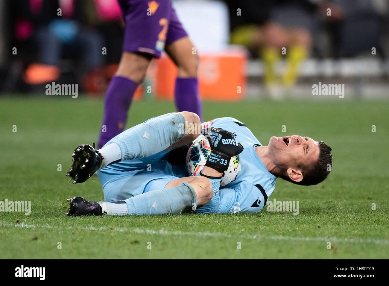 Perth Glory goalkeeper Liam Reddy (33) goes down injured Stock Photo ...