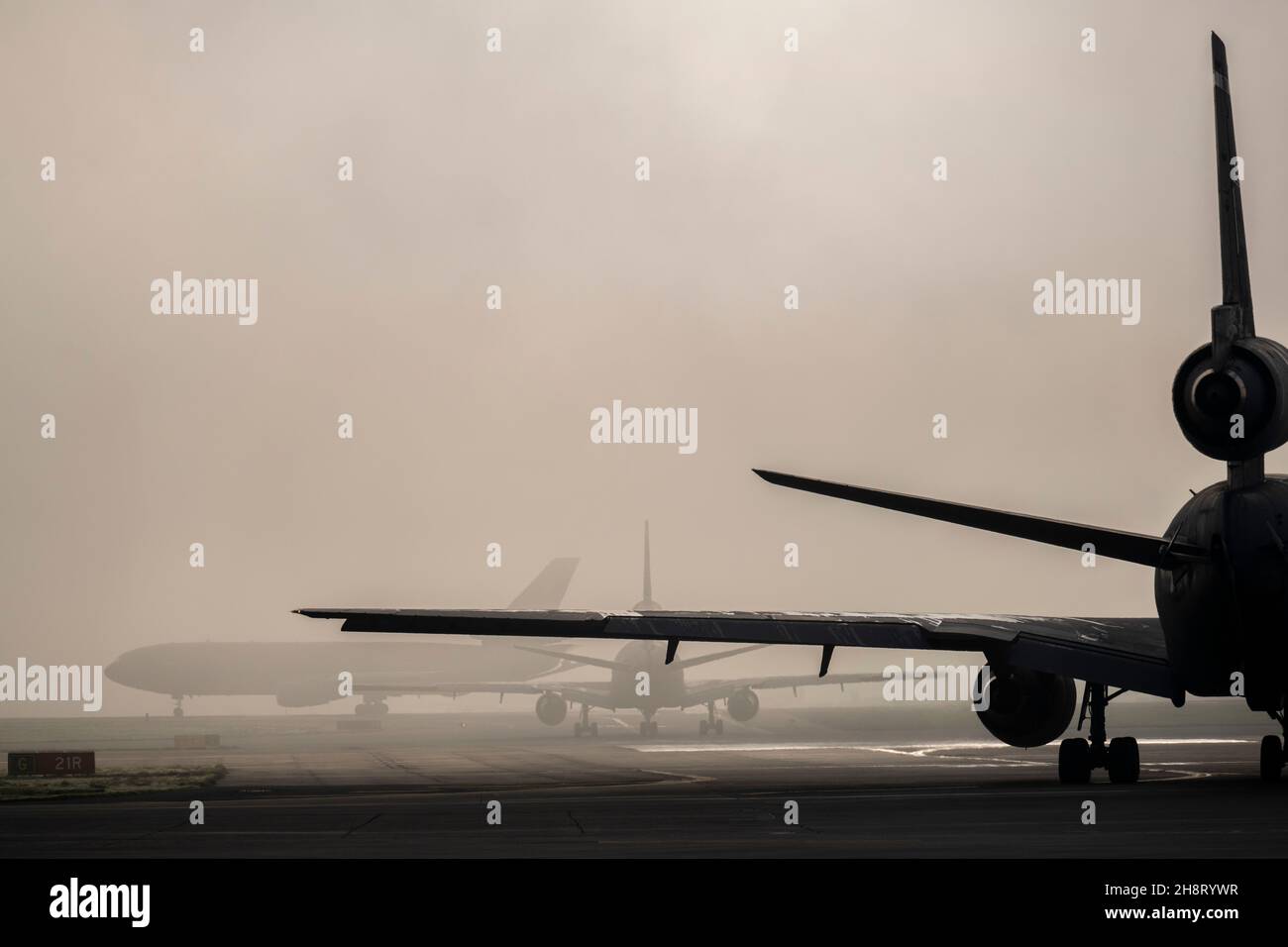 Three U.S. Air Force KC-10 Extender aircraft taxi on the flight line at ...