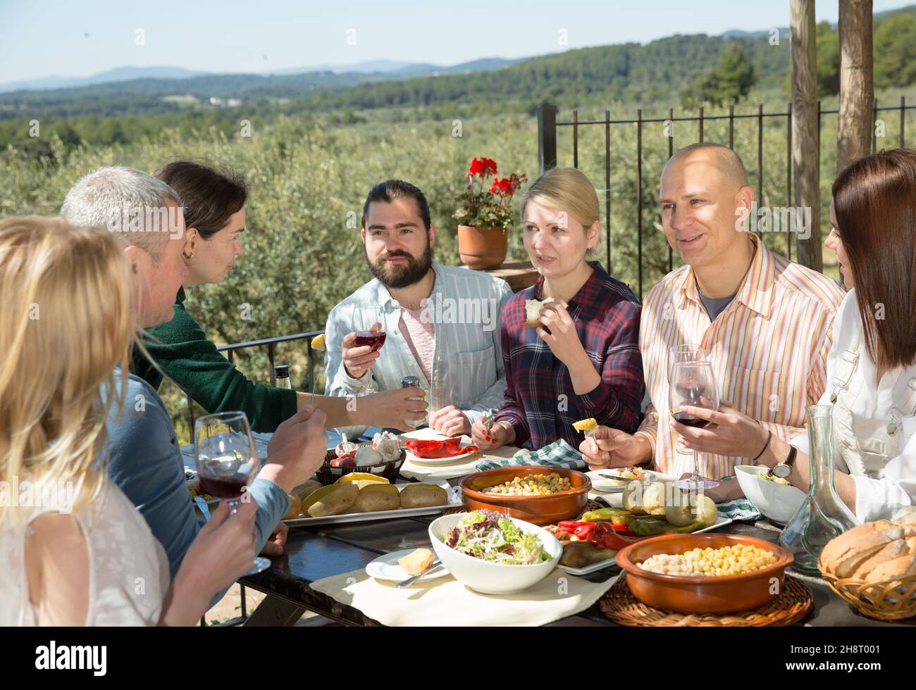 Friends chatting table on terrace hi-res stock photography and images ...