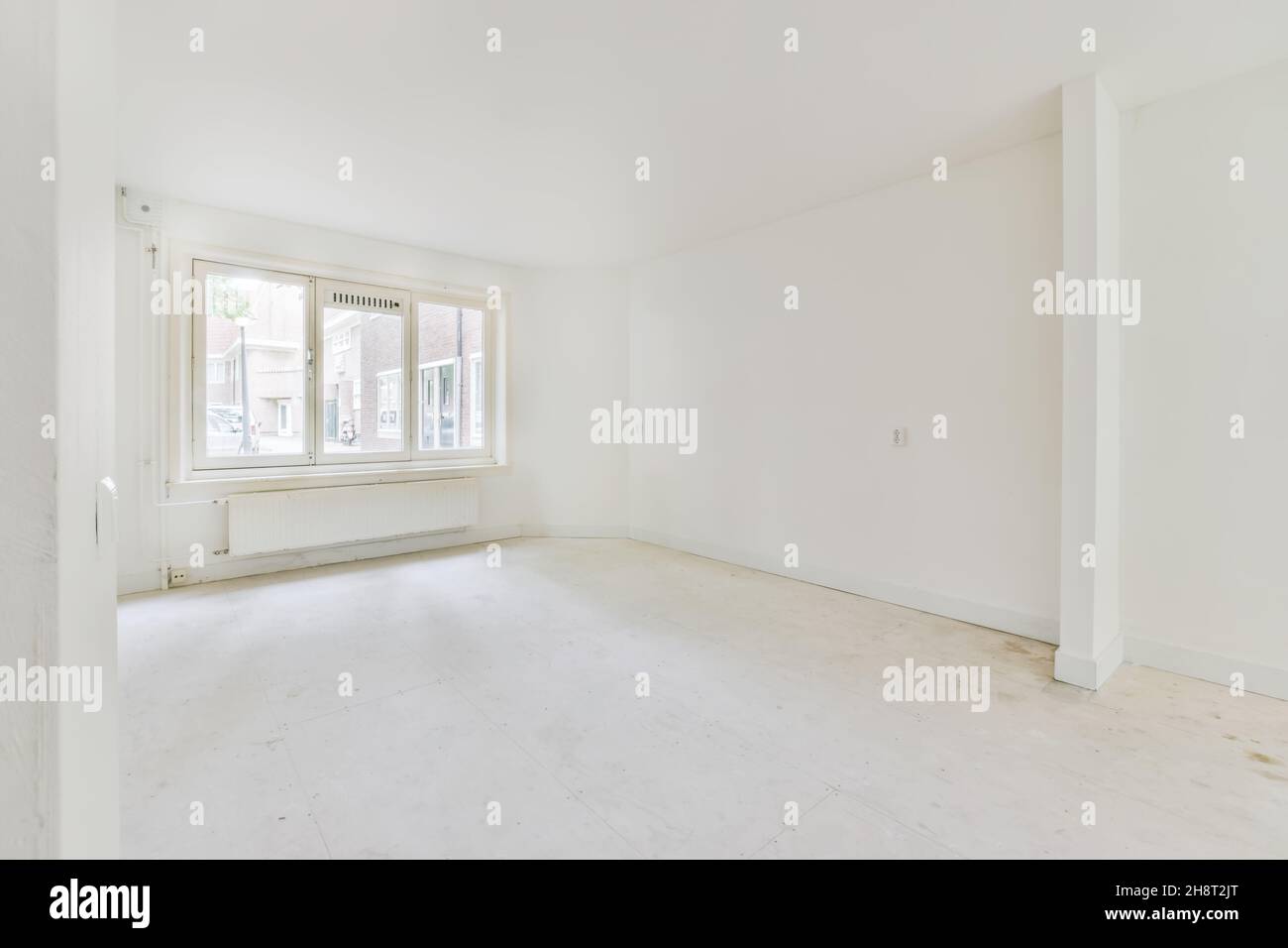 White room with windows in an elegant residential building Stock Photo ...