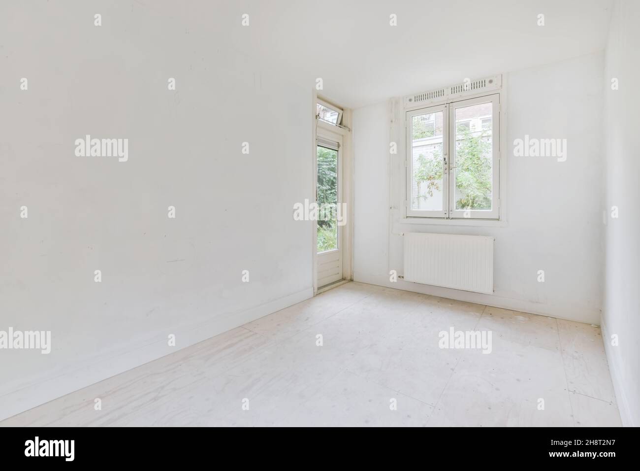White room with windows in an elegant residential building Stock Photo ...
