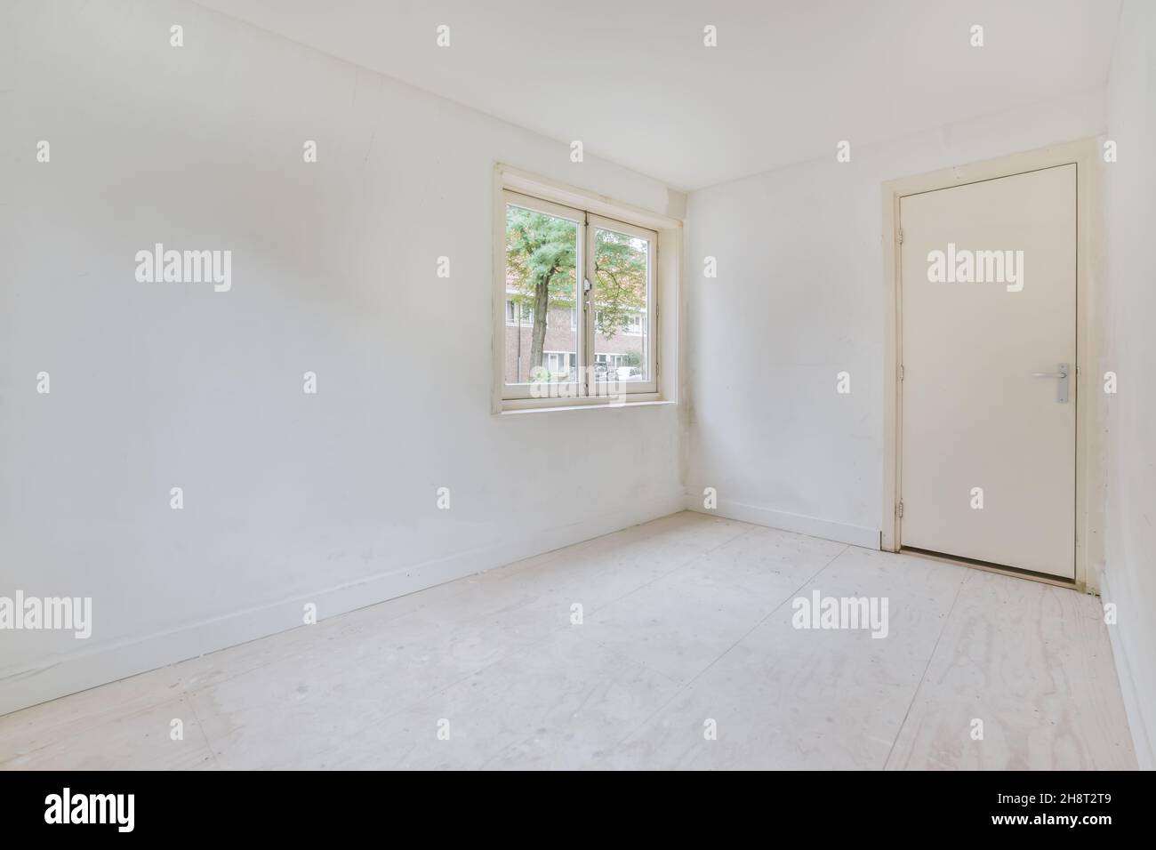White room with windows in an elegant residential building Stock Photo ...